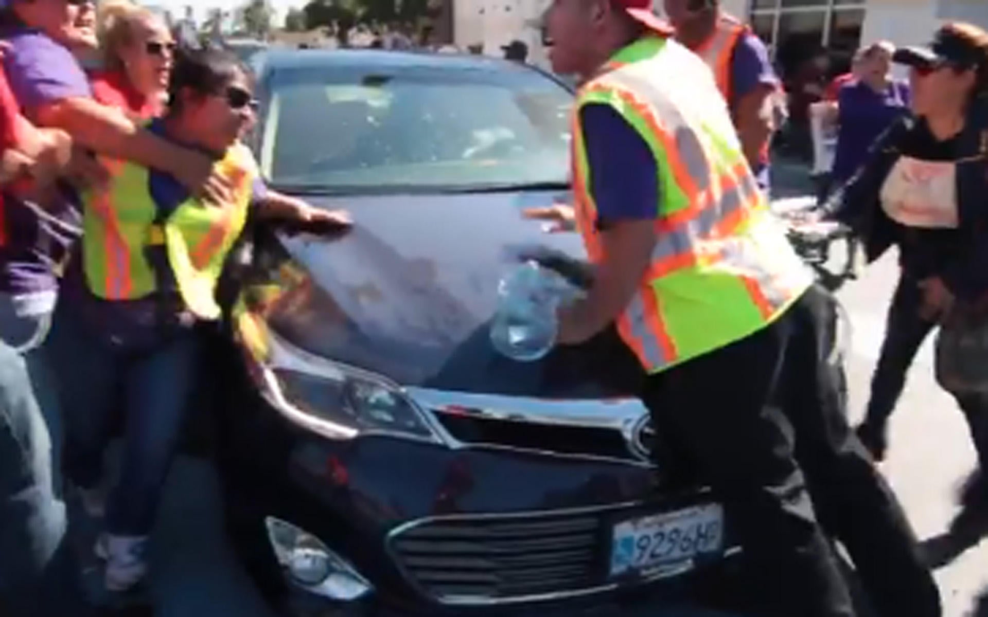 Dramatic video shows car driving into immigrant rights rally in ...