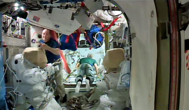 Astronauts prep for spacewalk to service lab's robot arm - CBS News