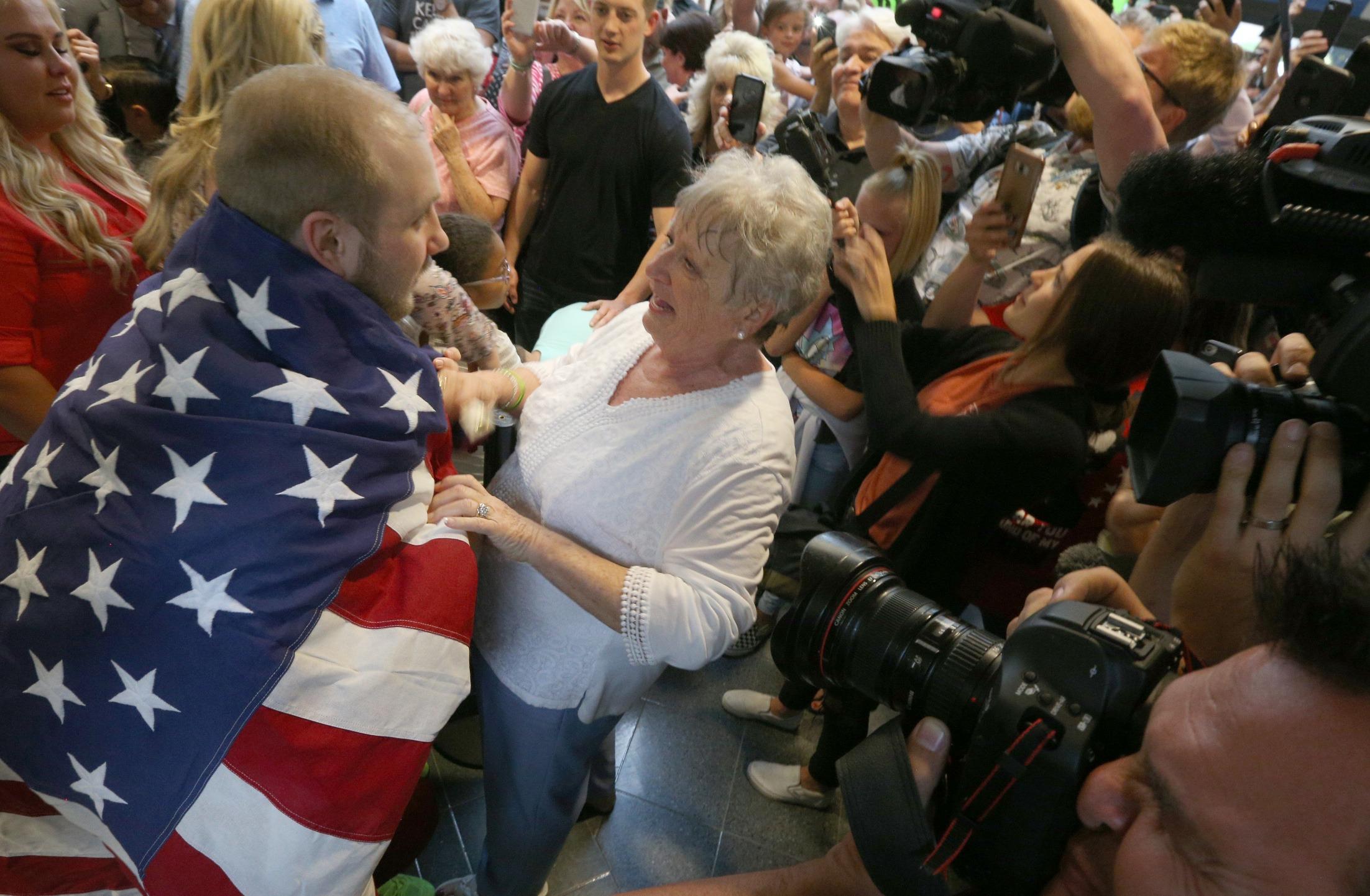 Josh Holt returns home to Utah, days after being freed from Venezuelan ...
