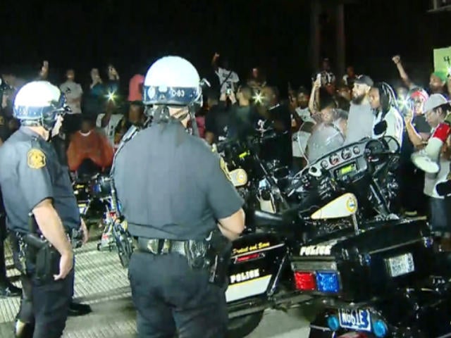Second night of rowdy protests over fatal police shooting of teen ...