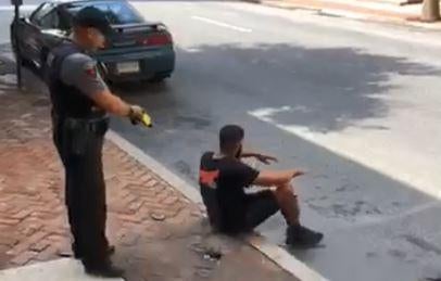 Video captures officers using stun gun on sitting man - CBS News
