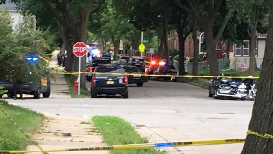 Milwaukee officer killed in shootout with suspect, police say - CBS News