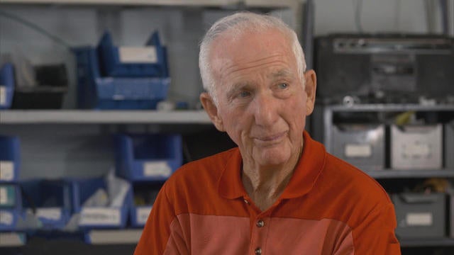 Retired veterinarian now spends his days helping disabled dogs - CBS News