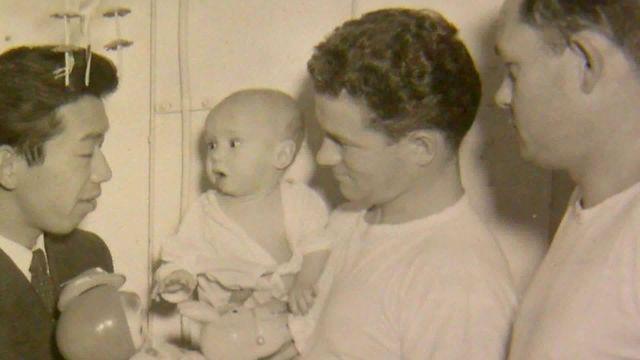 "Baby George": Navy medic reunites with infant saved from ash can in ...