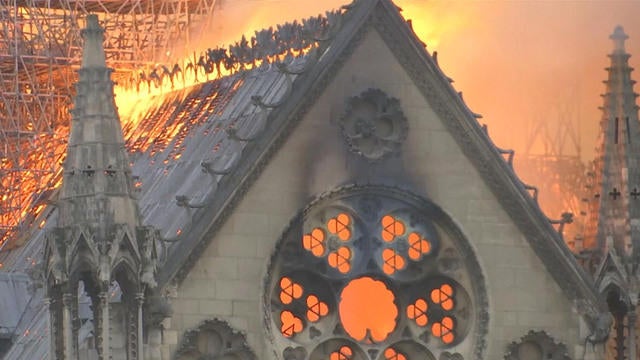 Notre Dame Cathedral fire: Spire and roof collapse as flames break out ...