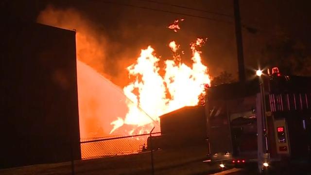 Jim Beam fire burns in warehouse in Versailles, Kentucky filled with bourbon whiskey - CBS News