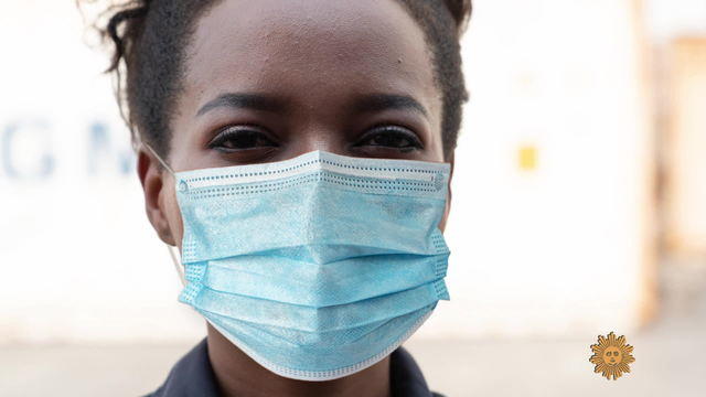The smile behind the mask - CBS News