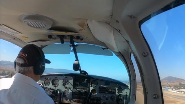 100-year-old World War II pilot says he still flies every week - CBS News