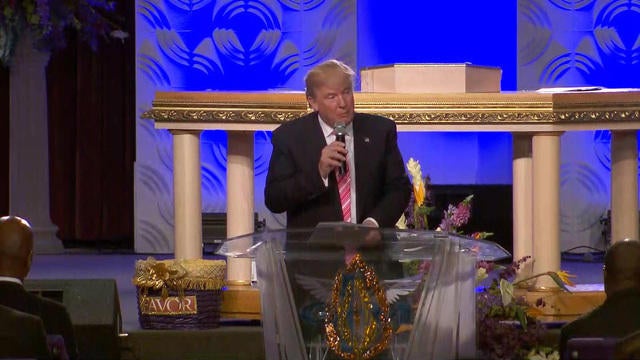 Angry protesters rally around church during Trump's Detroit visit - CBS ...