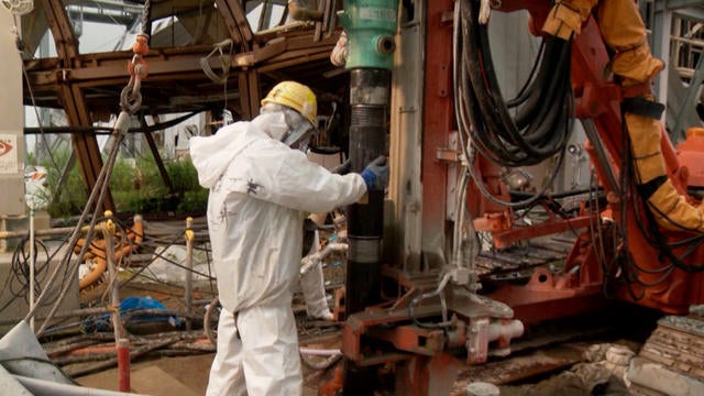 Japan switches on ice wall to pen radioactive leaks - CBS News