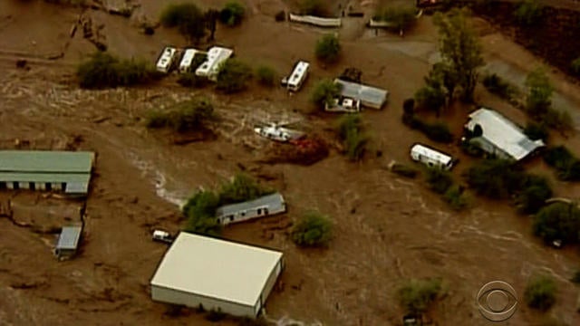 Residents, motorists stranded by raging floods in Arizona - CBS News
