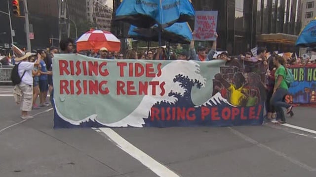 300,000 marchers ring climate warning bell in NYC, around globe - CBS News