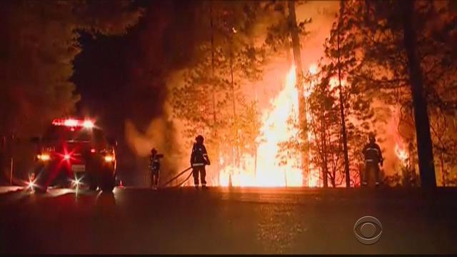 Fires continue to rage through California, displacing thousands - CBS News