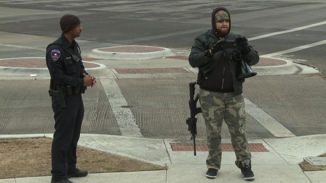As groups police the police, some add guns to the mix - CBS News