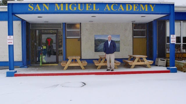 On crime-ridden streets, a priest and his school offer a way out - CBS News