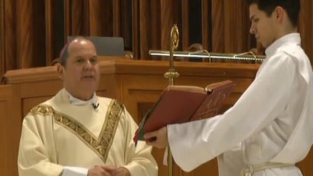 Video shows bishop punched while celebrating Mass in Newark - CBS News
