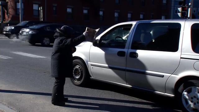 A city that puts panhandlers to work - CBS News