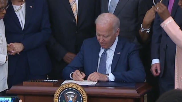 Biden signs bill making Juneteenth a federal holiday - CBS News