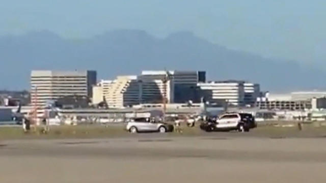 Police chase LAX intruder's car across two busy runways after major ...