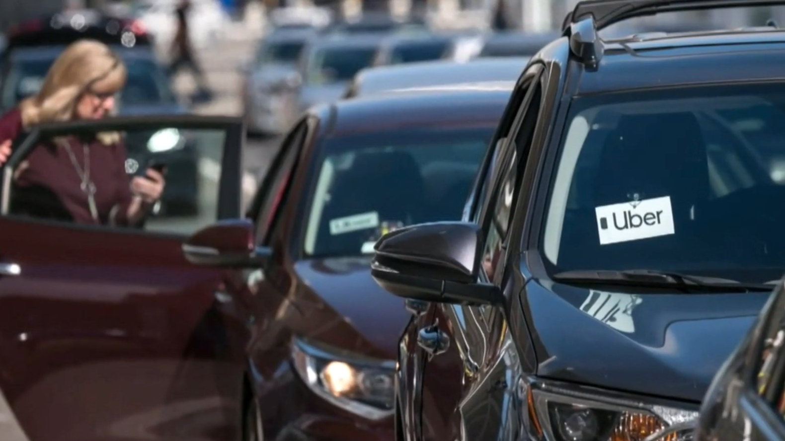 Department of Justice sues Uber for overcharging disabled people - CBS News