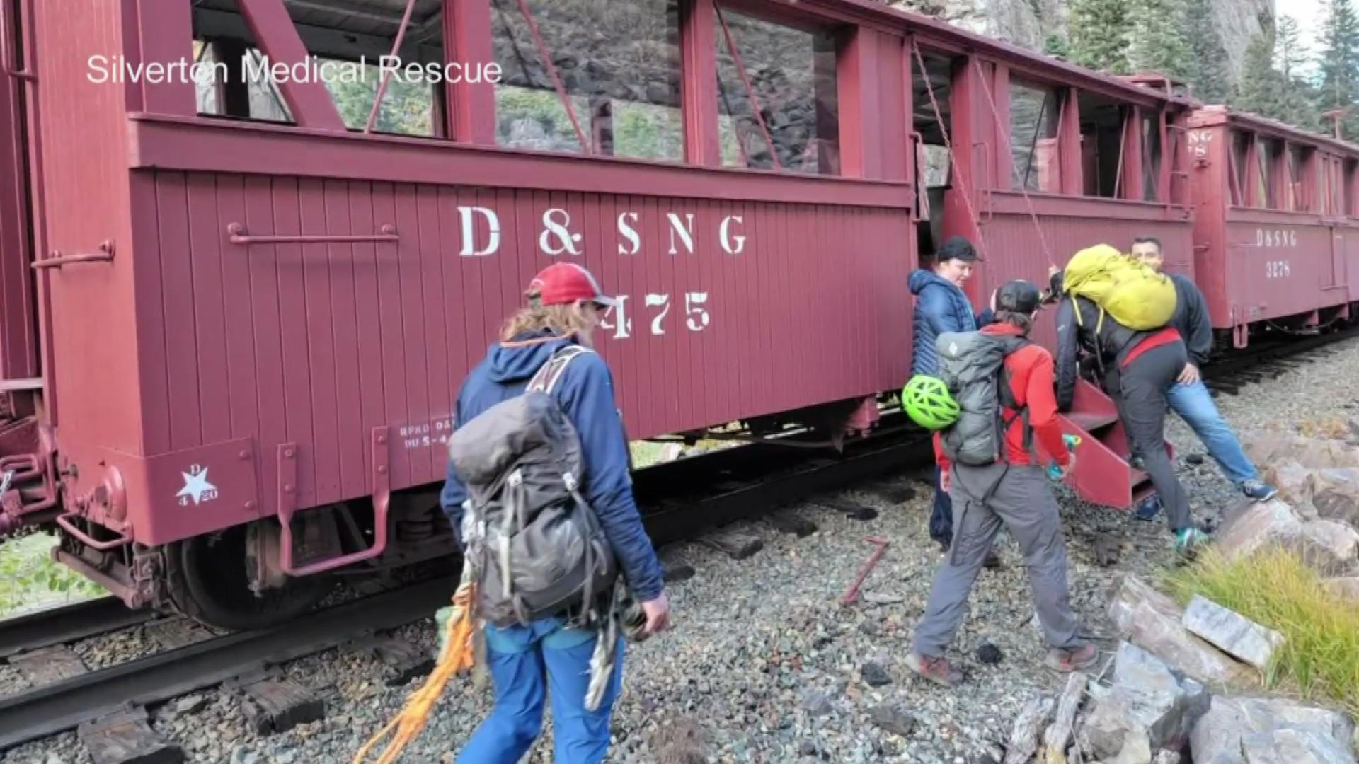 Crew members aboard a train helped an injured hiker to safety - CBS ...