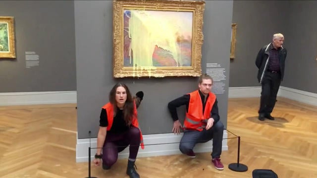 Climate activists throw mashed potatoes on Monet painting to protest ...