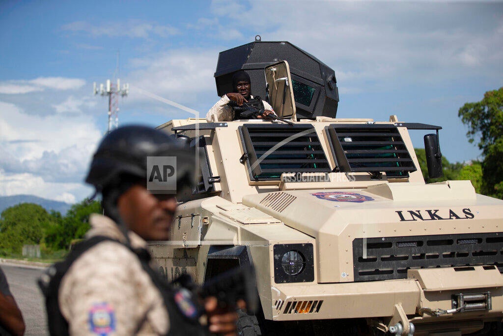 Haitian police briefly lose control of armored car - CBS Miami