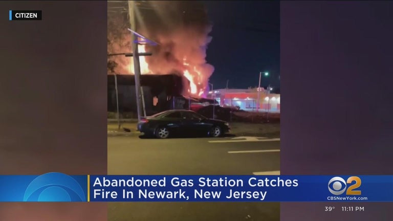 Abandoned gas station goes up in flames in Newark - CBS New York