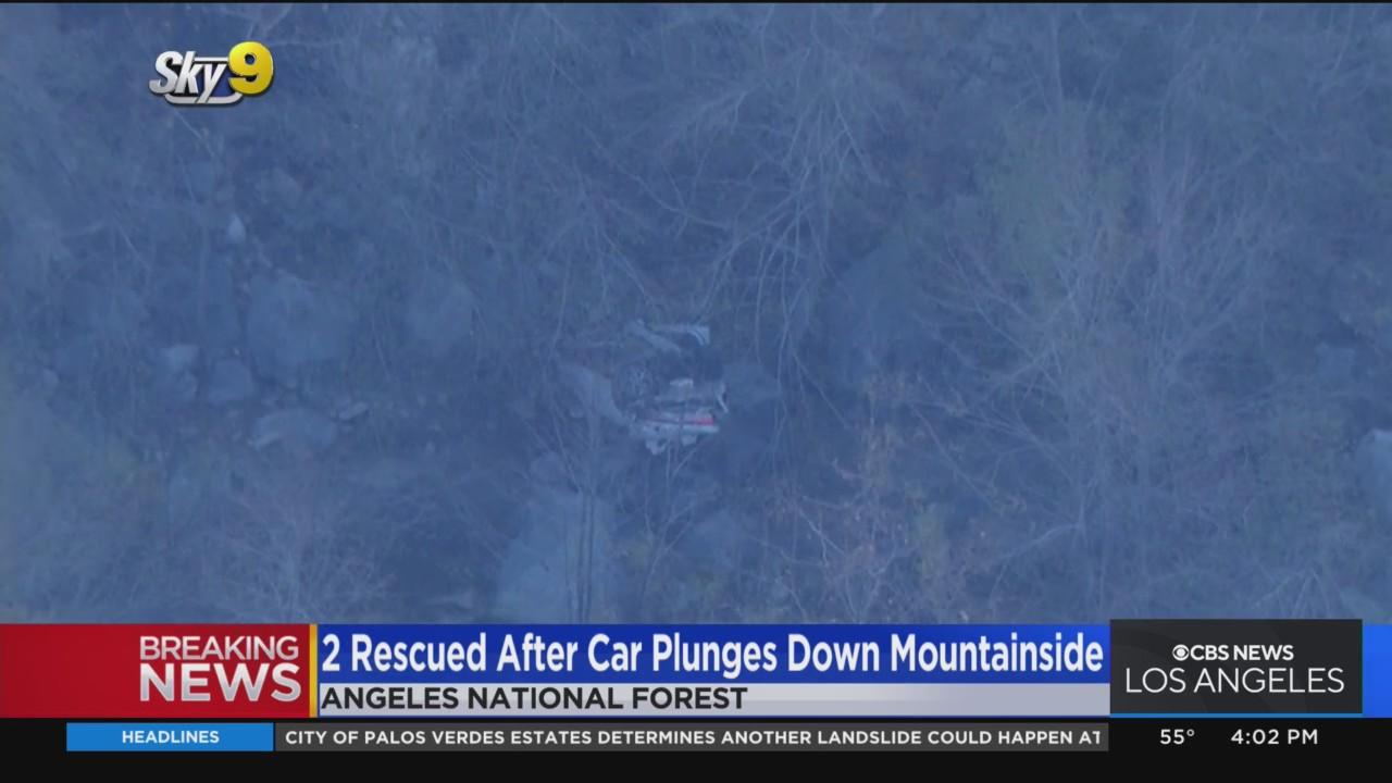 Dramatic video shows 2 people being rescued from car after surviving ...