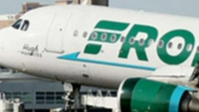 Frontier flight catches fire while landing at Las Vegas airport - CBS News