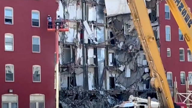 Trained dogs join search at Davenport, Iowa, collapsed building - CBS News
