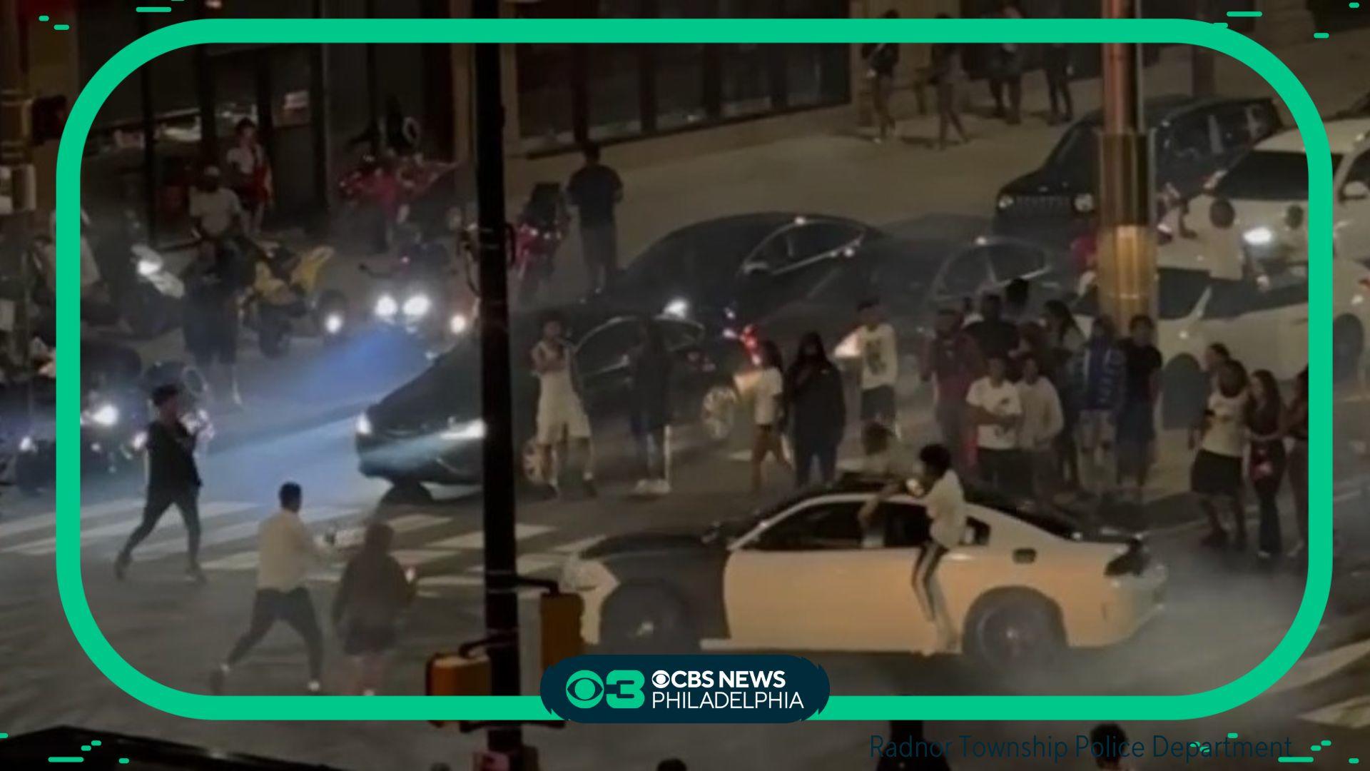 Officer struck by vehicle as police disperse crowd of more than 500 ...