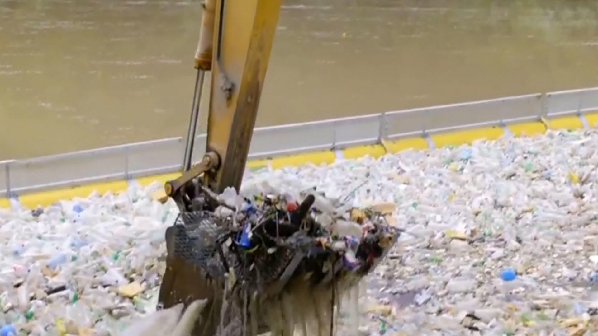 Ocean cleanup group deploys barges to capture plastic in rivers - CBS News