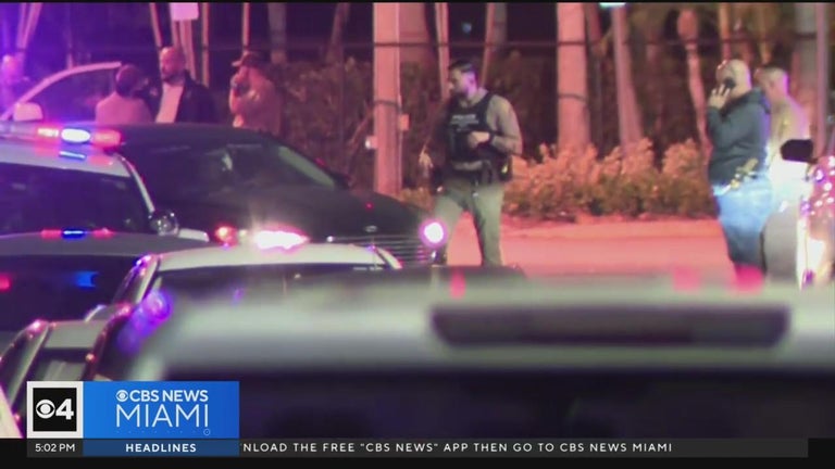 Two Miami-Dade police officers shot when responding to squatter call - CBS Miami
