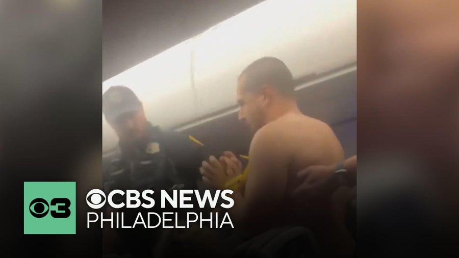 NJ man indicted after trying to open aircraft door mid-flight, needed ...