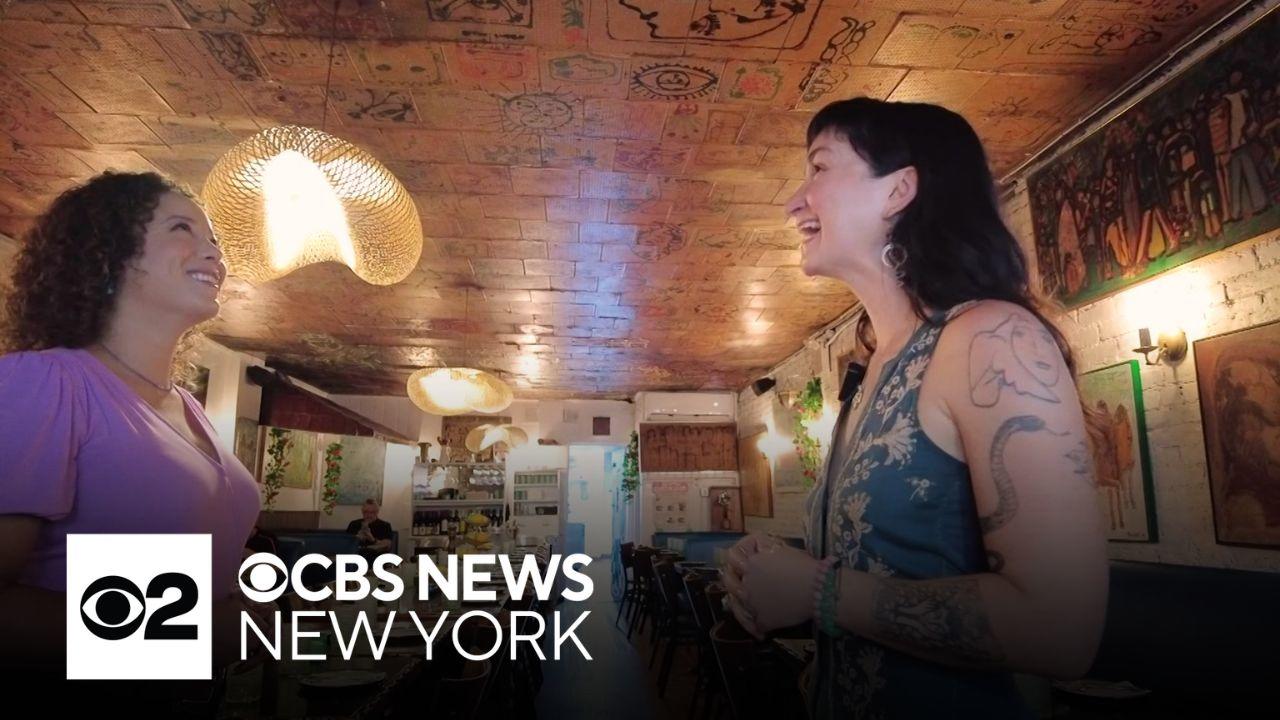 NYC artist helps restore mural after Greek restaurant suffered flood damage - CBS New York
