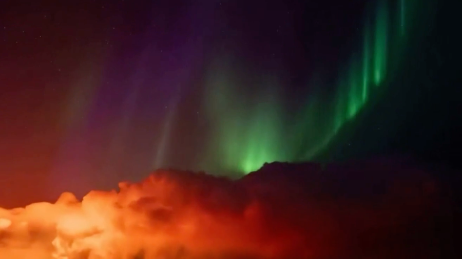Video shows northern lights dazzle above volcanic eruption in Iceland ...