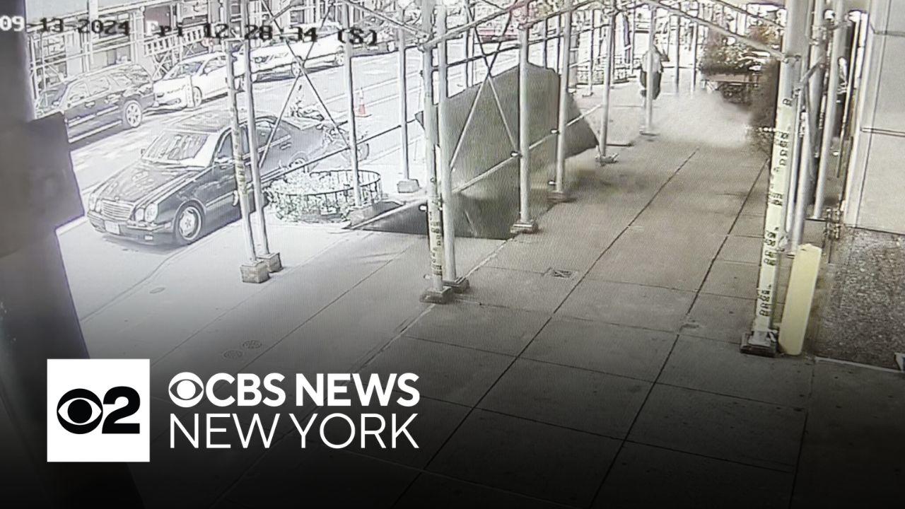 Caught on video: NYC manhole explosion causes sidewalk to buckle - CBS ...