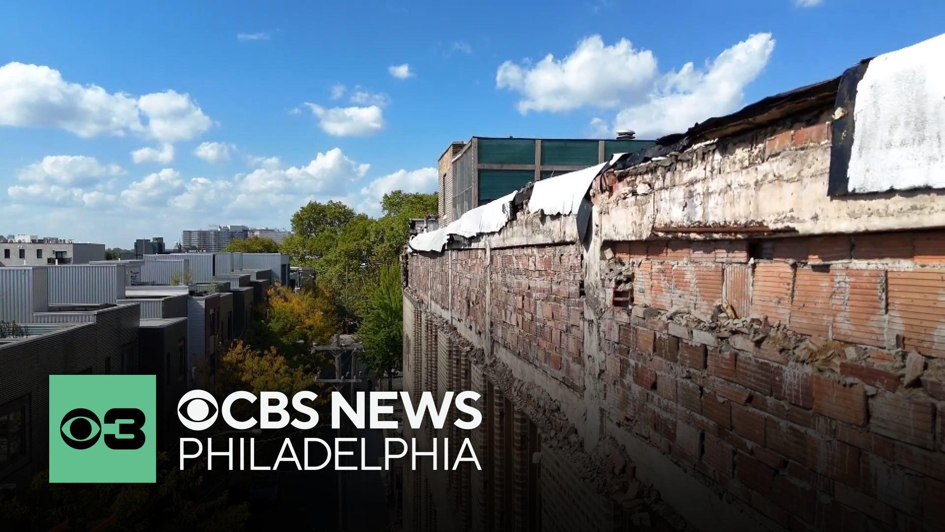 Cars, home damaged after apartment building wall collapses in ...