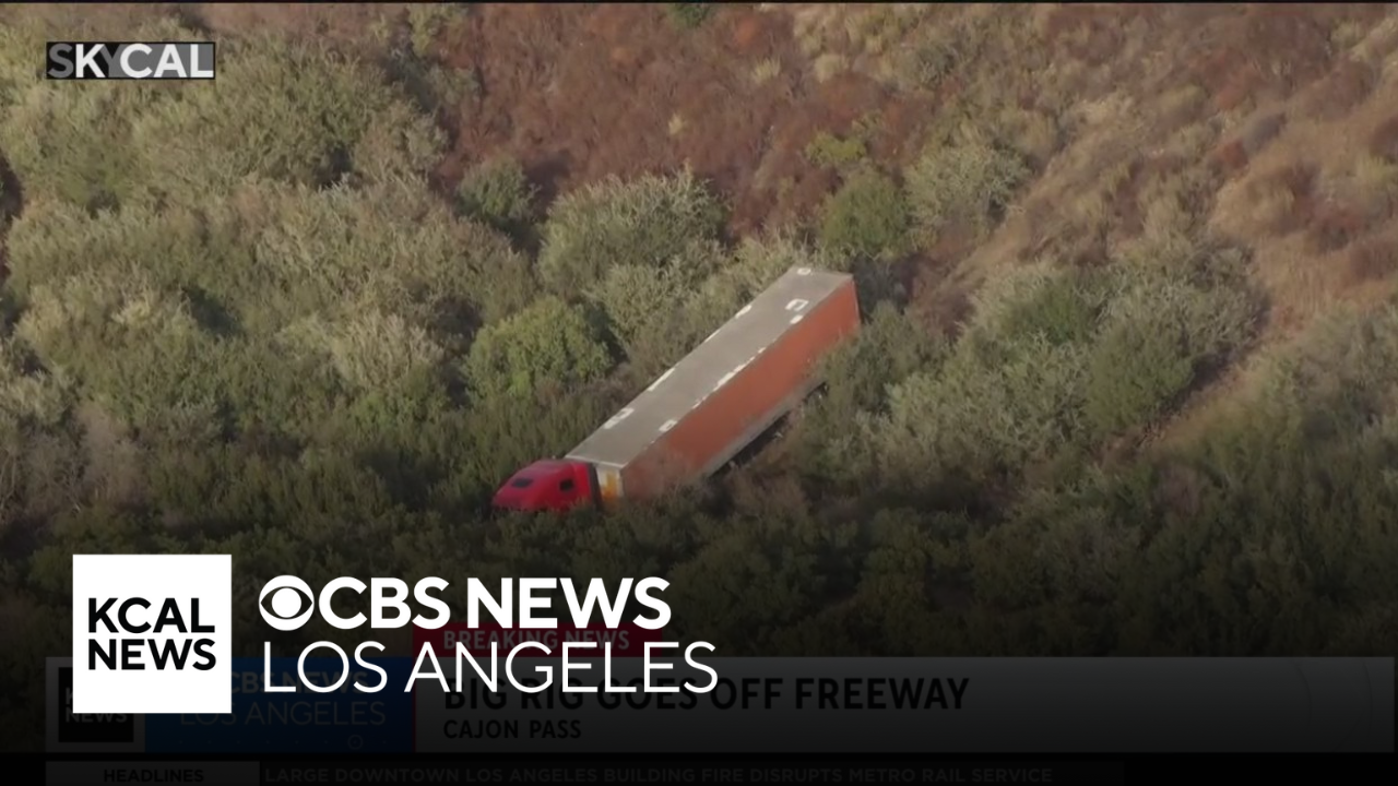 Big rig rolls down hillside after crashing into divider on I-15 Freeway ...