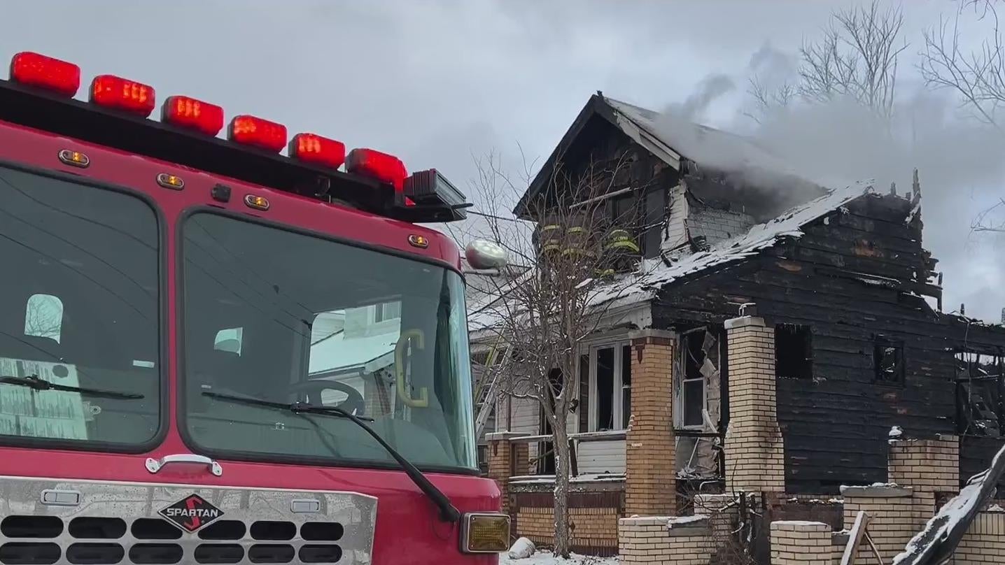 Woman displaced after large fire burns through multiple homes on ...