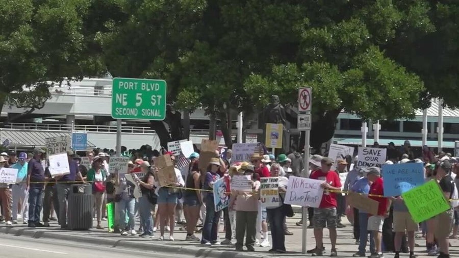 Demonstrators protest Trump at Miami's Torch of Friendship to speak out ...