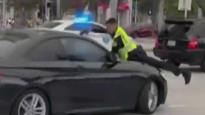 Cellphone video captures Miami officer firing at driver on hood of ...