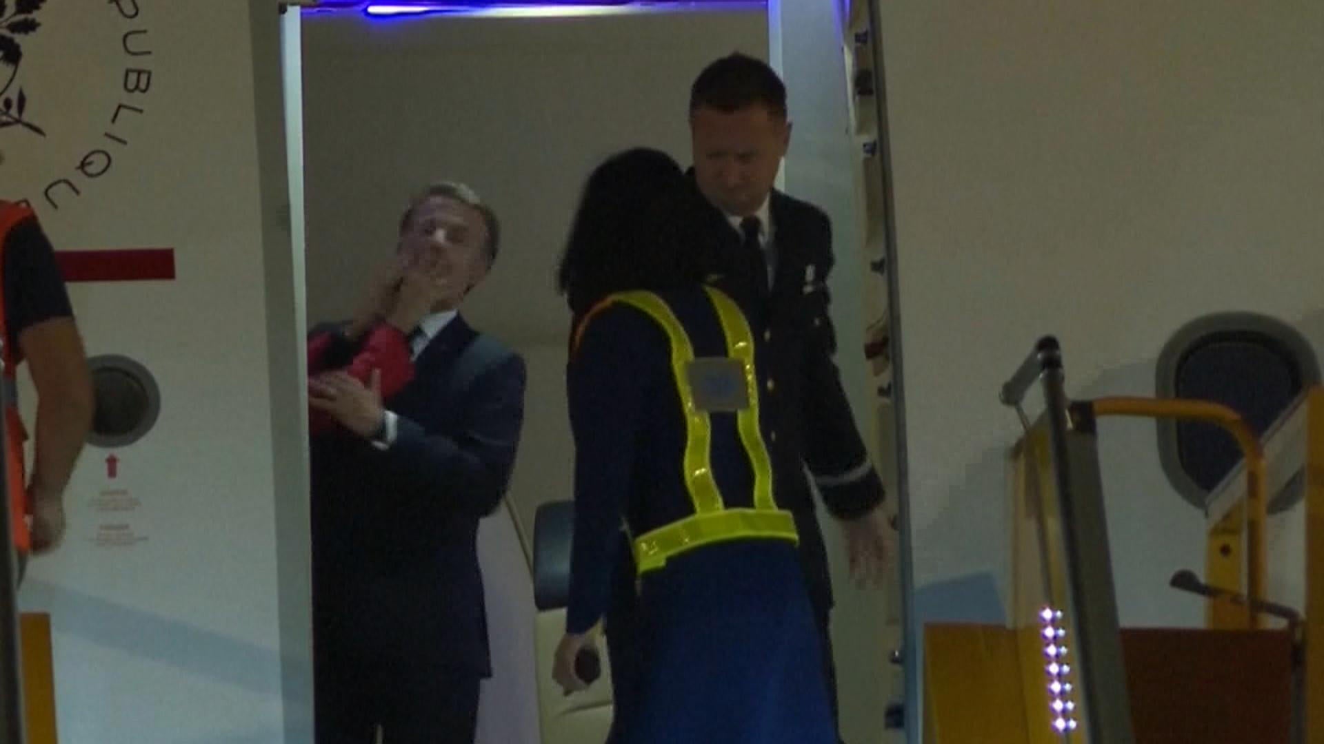 Emmanuel Macron's wife Brigitte Macron appears to shove his face upon ...