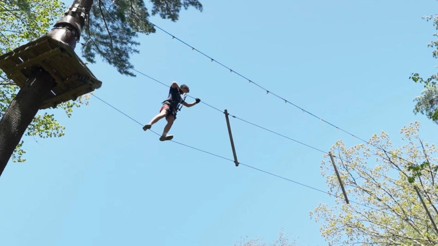 Zipline through the woods at outdoor obstacle course in Massachusetts ...