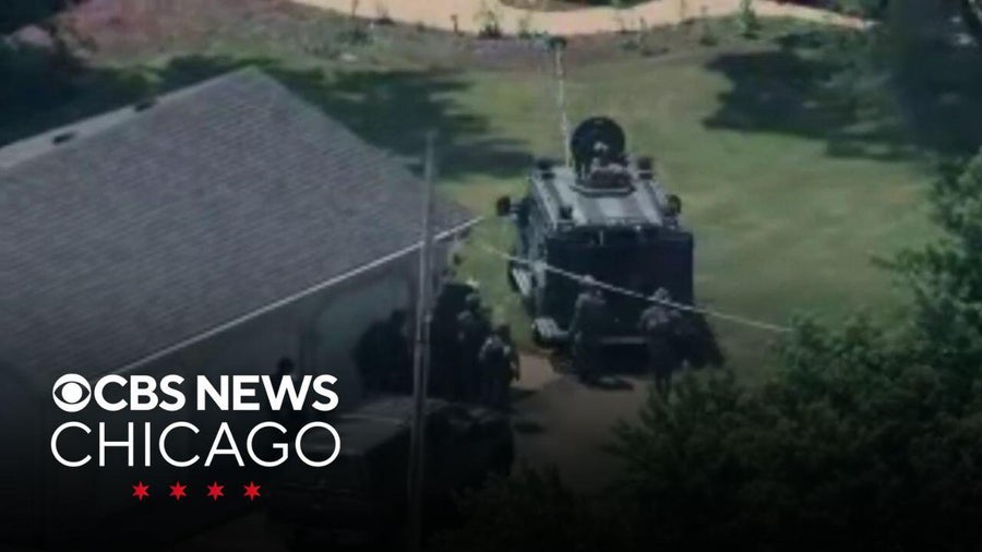 Police SWAT teams, armored vehicles surround home in McHenry, Illinois ...
