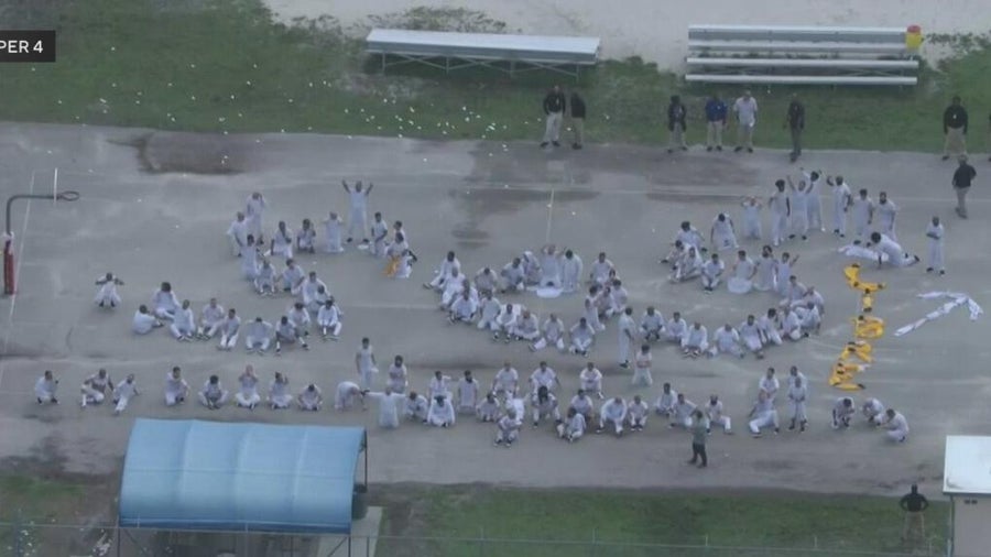 Detainees seen signaling "SOS" at Krome Detention Center, as ...