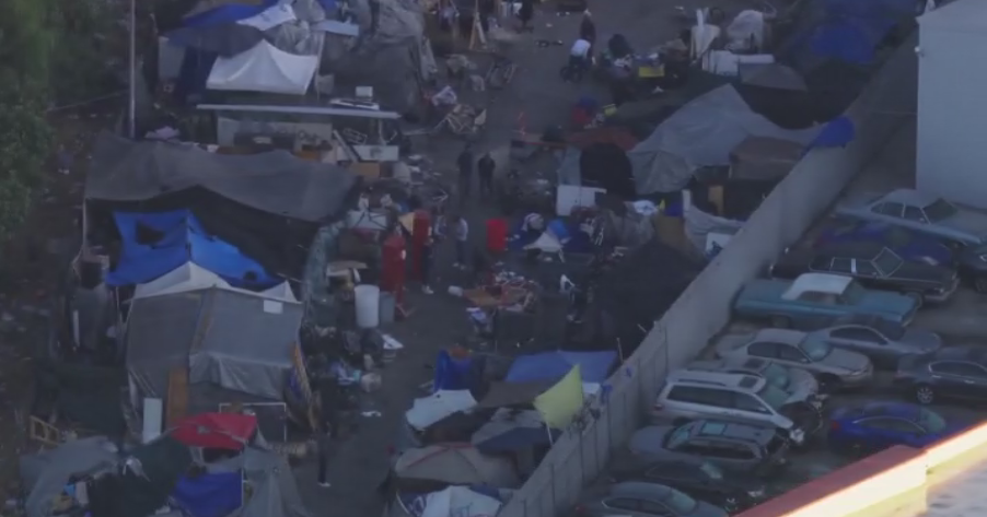 City officials clear large homeless encampment in Van Nuys near 405 Freeway through Inside Safe ...