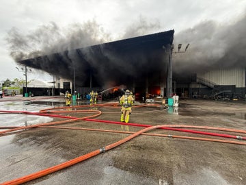 Auto warehouse bursts into smoky fire in Medley, causing roof to ...