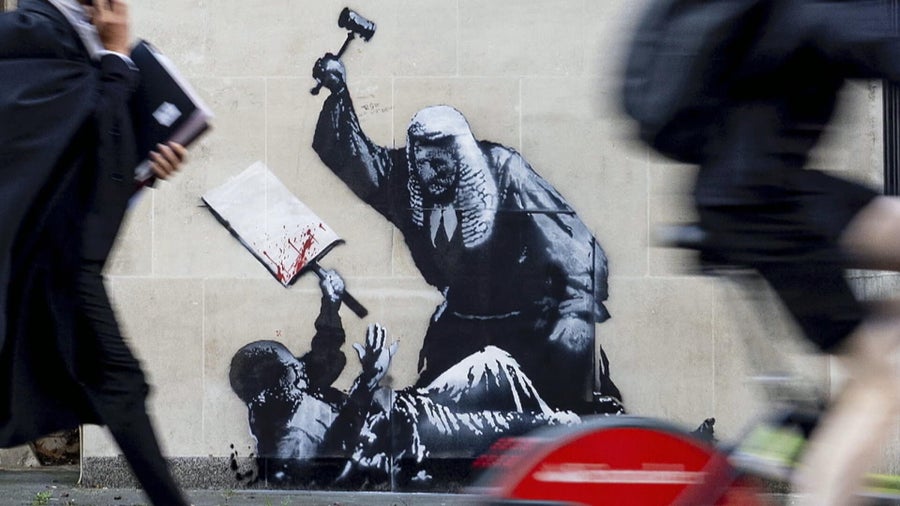 Banksy mural of judge beating protester at Royal Courts of Justice in ...